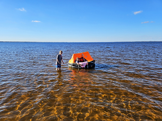 Crystal-clear shallows reveal Lake Waccamaw's sandy bottom. The water's so clean you could practically serve soup in it.