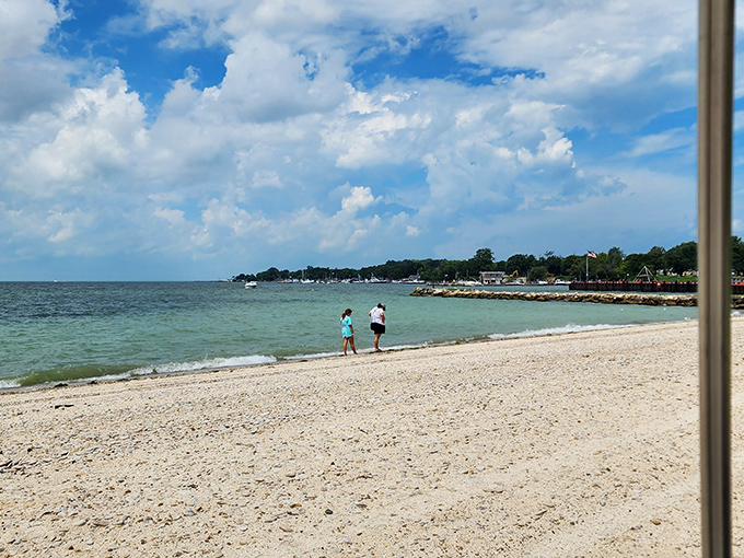 Two explorers chart their course along the shoreline. Lake Erie whispers secrets that only island-time visitors are relaxed enough to hear. 