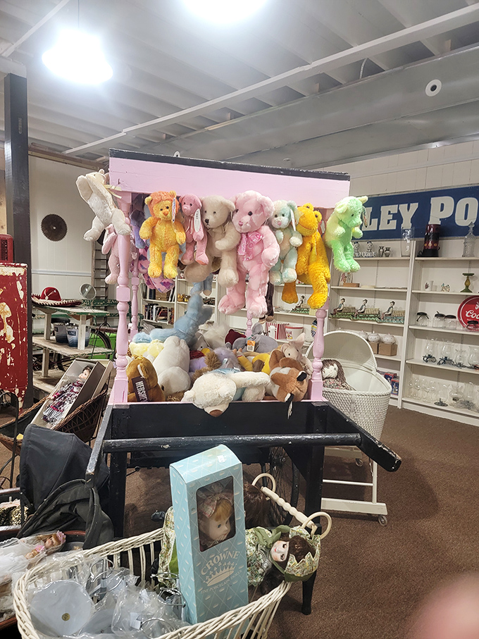 A pink display frame transformed into a stuffed animal gallery. These plush performers are just hanging around waiting for their next cuddle.