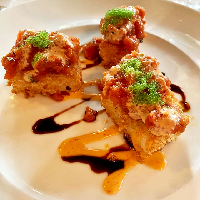 These crispy rice bites deliver flavor explosions with each bite&mdash;proof that sometimes the most memorable culinary experiences come in packages small enough to balance on chopsticks.