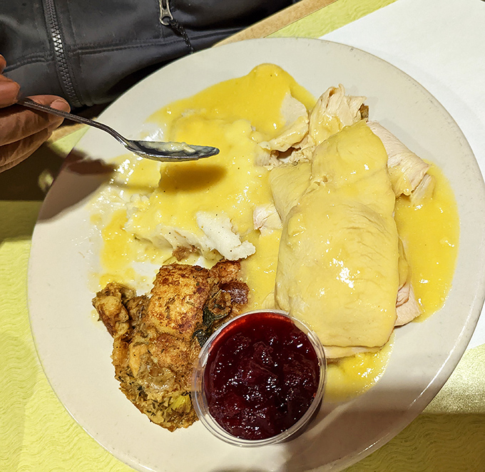 Behold the comfort food trifecta: tender turkey, creamy mashed potatoes, and a blintz with fruit compote that would make your grandmother weep with pride.