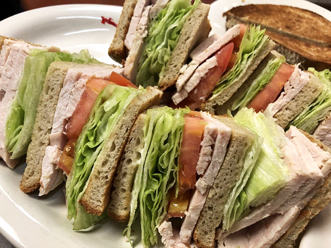 The legendary turkey club sandwich, stacked higher than some Philadelphia skyscrapers, with layers of house-roasted turkey that justify the diner's poultry reputation.