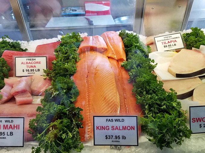 The fish market's rainbow of oceanic treasures&mdash;from vibrant salmon to pristine white fillets&mdash;artfully displayed like edible jewels on beds of green.