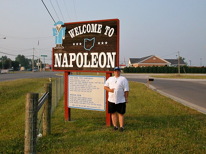 Napoleon's welcome sign greets visitors with Midwestern hospitality, promising small-town charm without the small-town nosiness about your business.