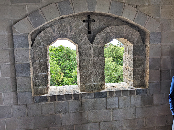 Stone-framed windows offer glimpses of lush Florida greenery, bridging centuries with each glance outside.