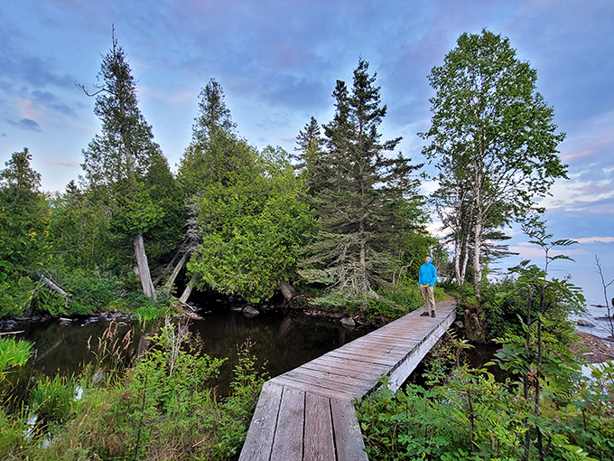 This humble wooden bridge connects more than just shorelines&mdash;it connects modern visitors to a wilderness experience increasingly rare in our digital world.
