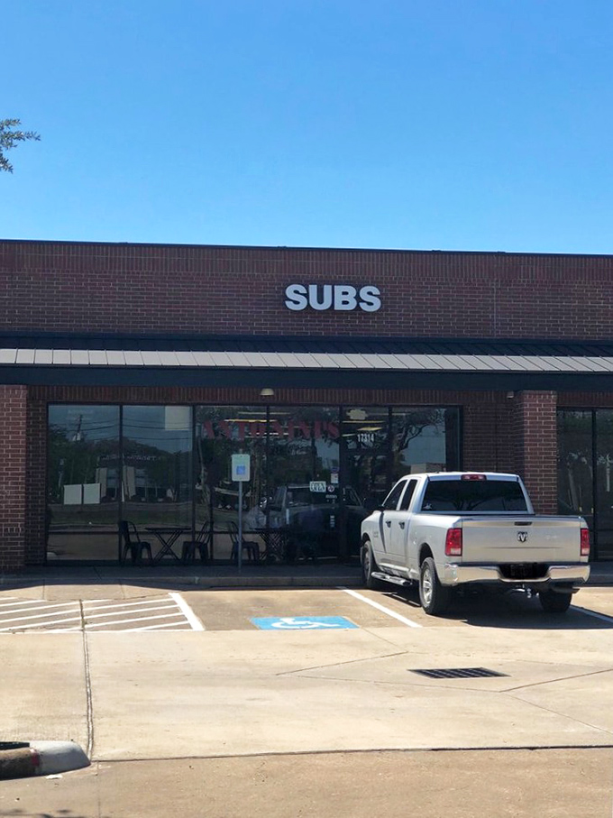 Sometimes the most unassuming storefronts hide the greatest sandwich treasures. This simple "SUBS" sign marks the spot.