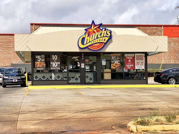 Church's star-topped sign promises crispy salvation for fried chicken pilgrims day or night.