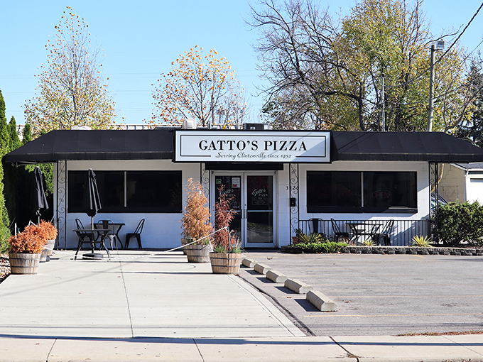 That classic black and white design screams "serious pizza joint" - no gimmicks, just pure deliciousness inside.