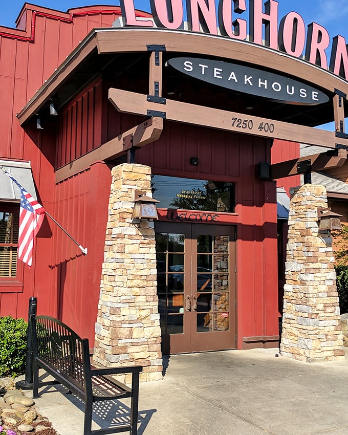 The bold red exterior with stone accents stands out like a Texas ranch house in the Lowcountry.