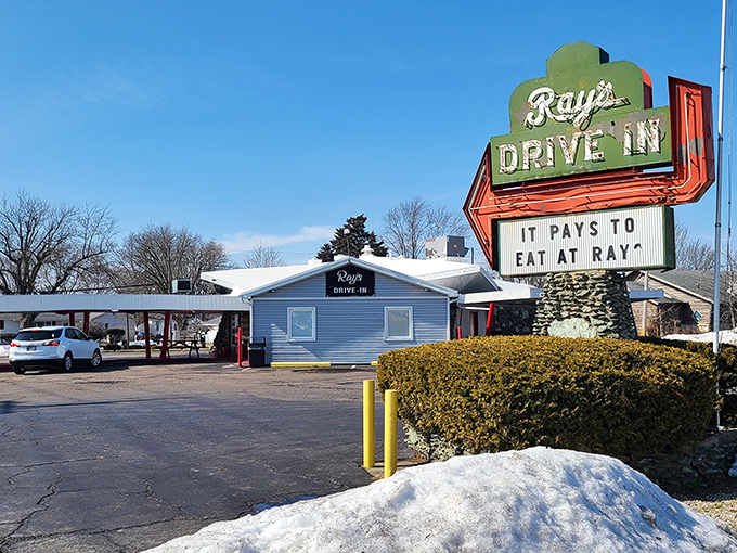 Ray's neon promise shines bright, guiding Kokomo's hungry masses to drive-in delights since way back when.