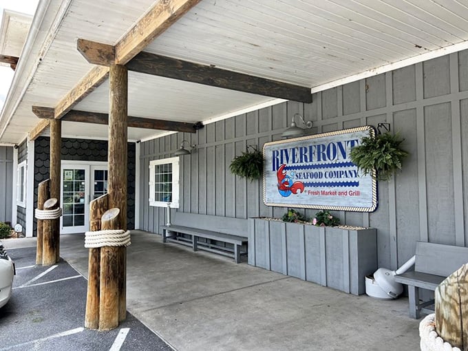 Riverfront Seafood Co's rustic wooden posts and coastal-inspired sign give you that "vacation by the water" feeling before you even taste the food.