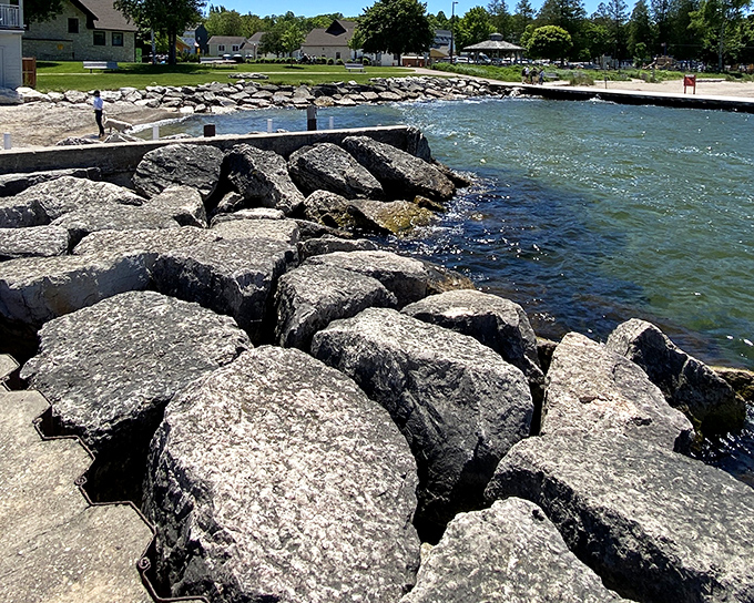 Rocky shores meet crystal waters at Sister Bay, where nature's artwork is on permanent display.