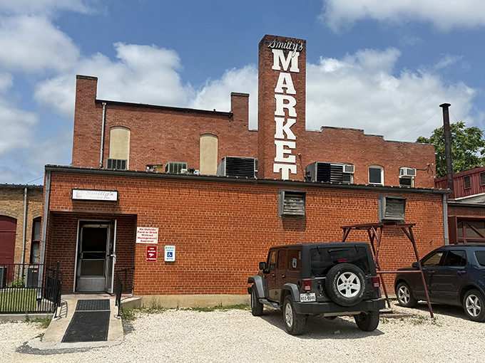 Smitty's Market's brick building stands like a barbecue fortress. That smokestack has been perfuming Lockhart's air for generations.