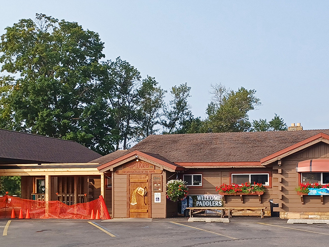 Spike's rustic log cabin exterior promises the kind of hearty meal you need after a day on Michigan's rivers.