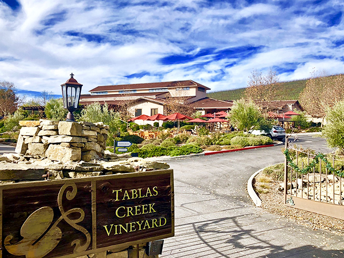 Welcome to wine country's friendliest front porch. Tablas Creek's entrance sign promises authentic experiences without the pretense.