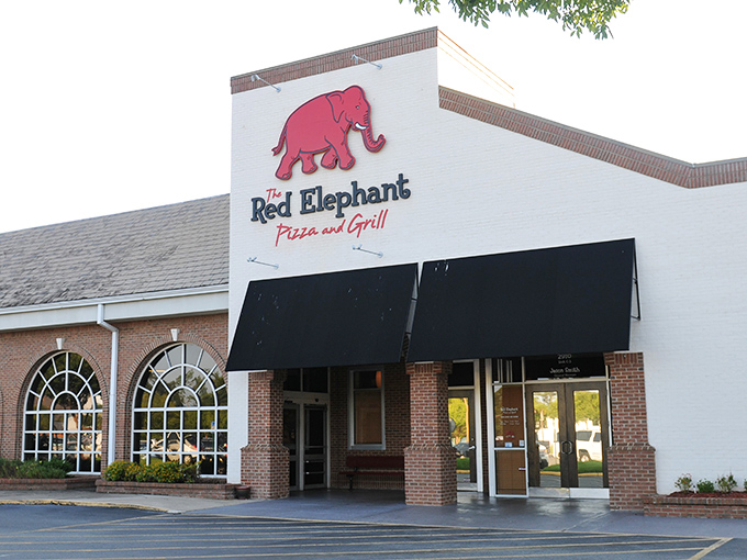The Red Elephant's welcoming facade has "family dinner night" written all over it. Those arched windows frame pizza memories waiting to happen.