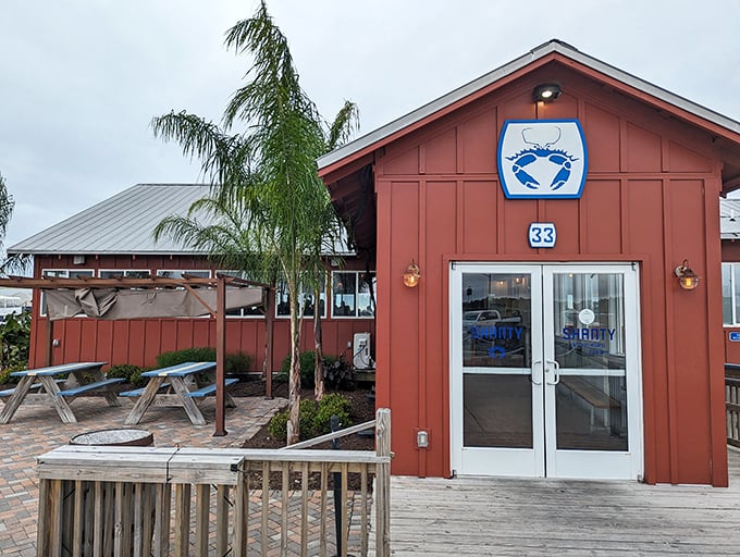 The Shanty's rustic red exterior hides seafood treasures within. That blue crab sign knows exactly what you came for.