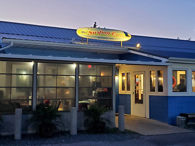 The Surfing Crab's bright blue exterior and surfboard sign perfectly capture that "just off the beach" vibe that makes seafood taste better.