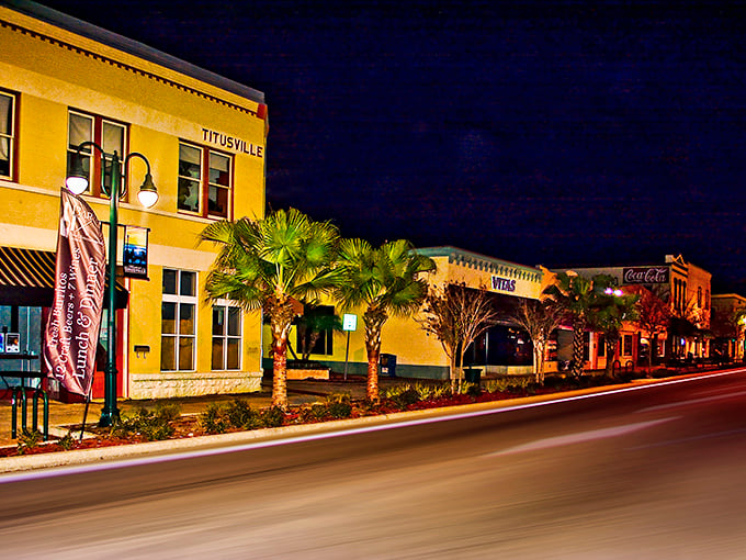 Titusville's revitalized downtown glows with possibility at night, offering Space Coast living without astronomical prices.