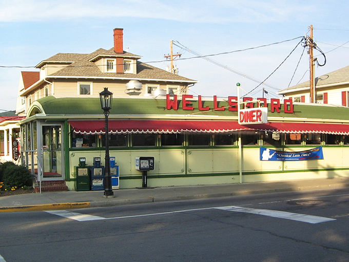 Wellsboro's iconic green diner gleams in the sunlight, promising comfort food that tastes even better than your childhood memories.