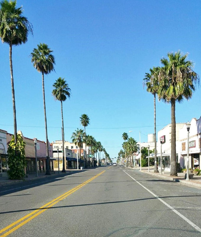Weslaco's palm-lined main street beckons with the promise of shade and shopping&mdash;a tropical Main Street USA.