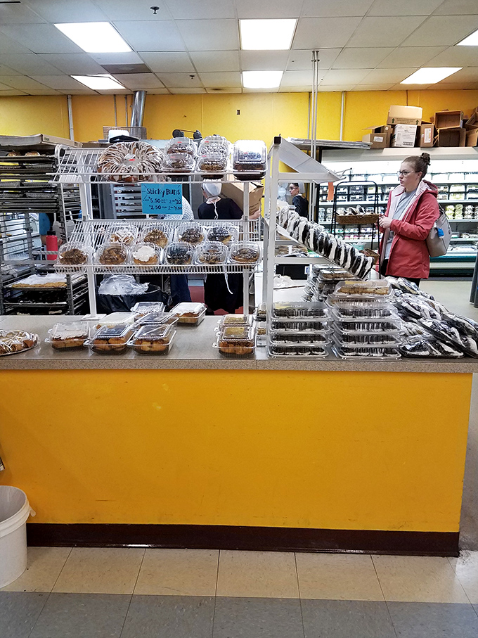 Simple yellow counters showcase treats made with generations of expertise. No fancy display needed when the donuts speak for themselves.