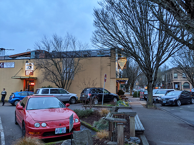 Evening lights transform this corner spot into a cozy haven where pizza dreams come true for hungry college students and locals alike.