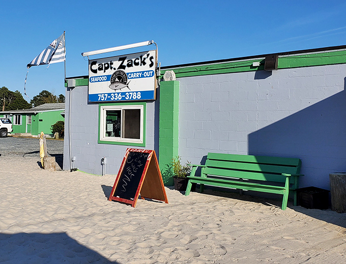Sandy paths lead to seafood treasures! Captain Zack's humble exterior and beach-side bench promise simple, spectacular catches.
