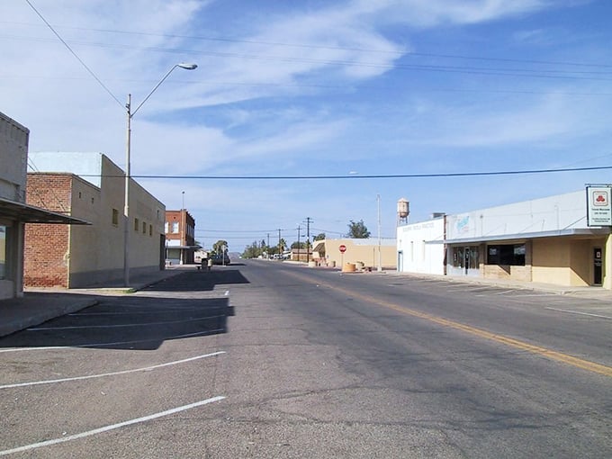 Coolidge's quiet downtown street shows wide roads, minimal traffic, and locally-owned businesses lining the way.