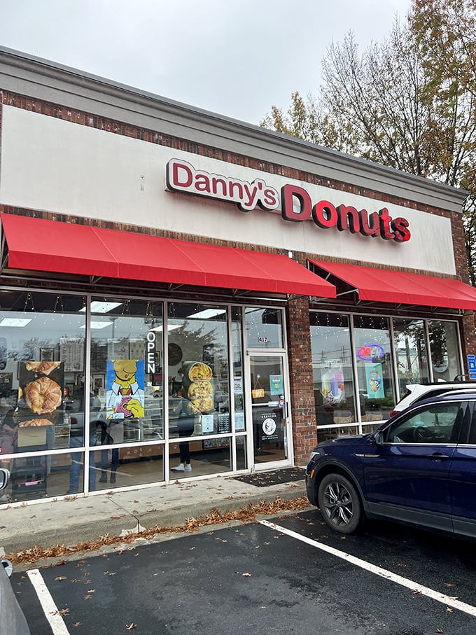 Danny's red-trimmed windows frame a world of donut possibilities. Sometimes the most unassuming places hide the sweetest treasures.