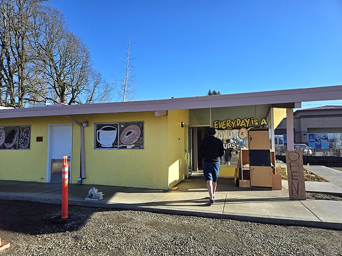 The sunny yellow exterior and welcoming entrance of Donut Day. Where Beaverton residents start their mornings right.