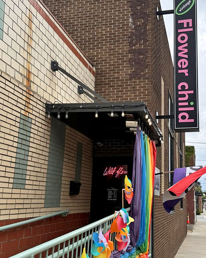 Rainbow fabrics flutter outside Flower Child's entrance, hinting at the kaleidoscope of decades waiting inside.