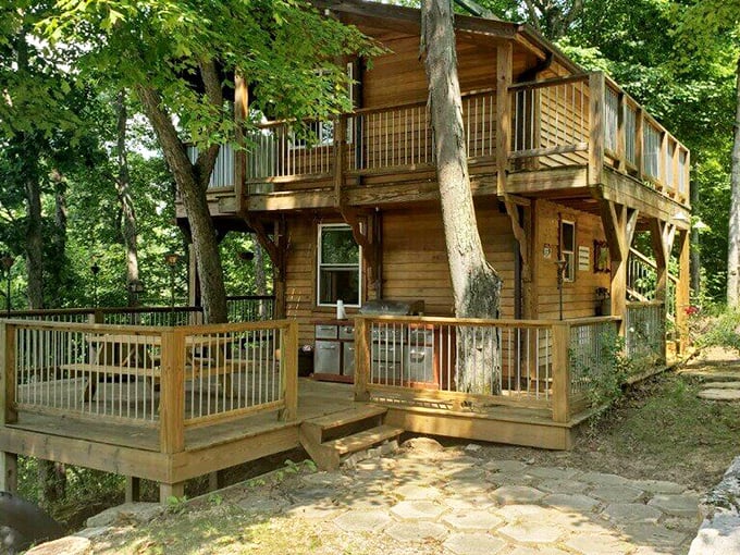 Relax in your dreamy wooden treehouse, where you can cook outdoors and soak in the lush greenery of French Lick.