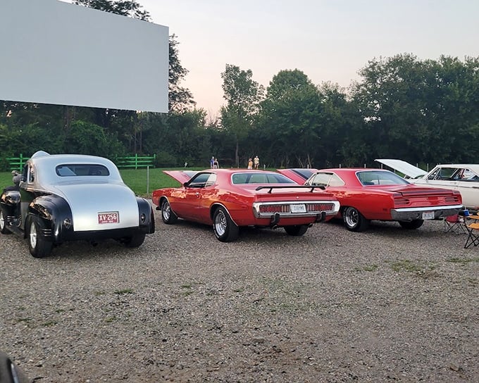That welcoming ticket booth at Holiday Auto Theatre glows like a beacon. The neon "Welcome" sign says it all&mdash;movie magic awaits!