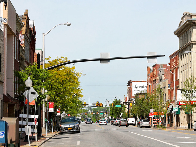 Red brick buildings anchor this college town where modern life and nostalgic charm find perfect harmony in every storefront.