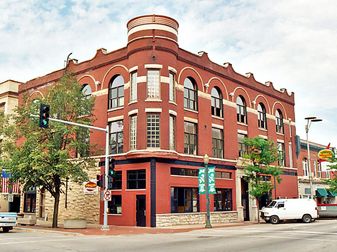 This distinctive red corner building anchors a historic Joliet intersection. Its curved facade practically begs you to peek inside for a cup of coffee.
