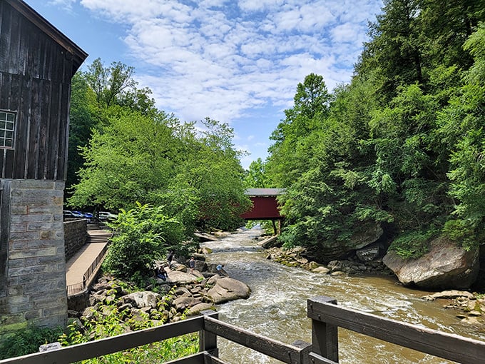 A red covered bridge spans the rushing creek at McConnells Mill, proving that Pennsylvania does "rustic charm" better than any Pinterest board.