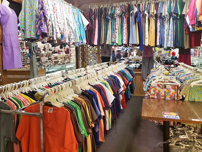 Rainbow rows of clothing create a shopper's paradise where yesterday's trends become tomorrow's statement pieces.