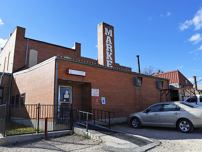 The historic brick facade of Smitty's whispers tales of barbecue past. Where meat-smoking traditions remain gloriously unchanged.