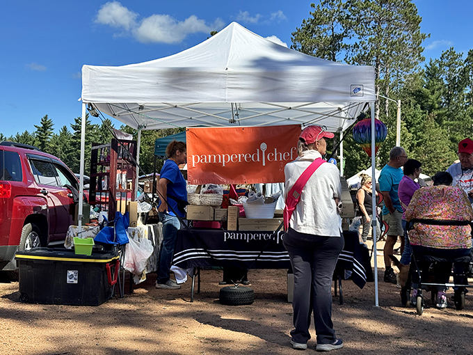 Outdoor browsing feels like vacation shopping, where every tent holds potential cabin treasures and lake memories.