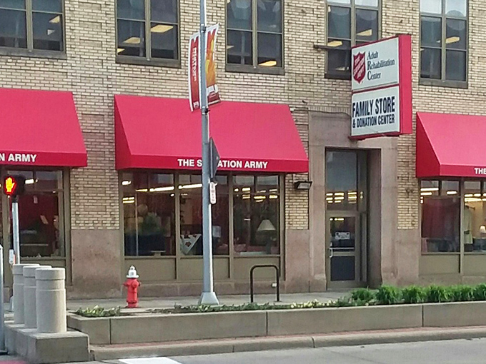 The Salvation Army's red awnings pop against brick like cherries on a sundae of savings. 