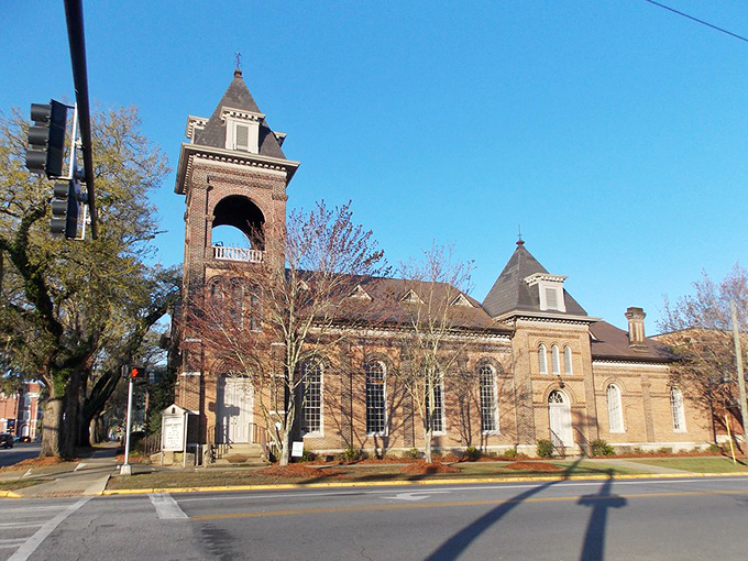 Brick facades and blue skies frame Thomasville's main street, where Southern charm comes standard with every hello.