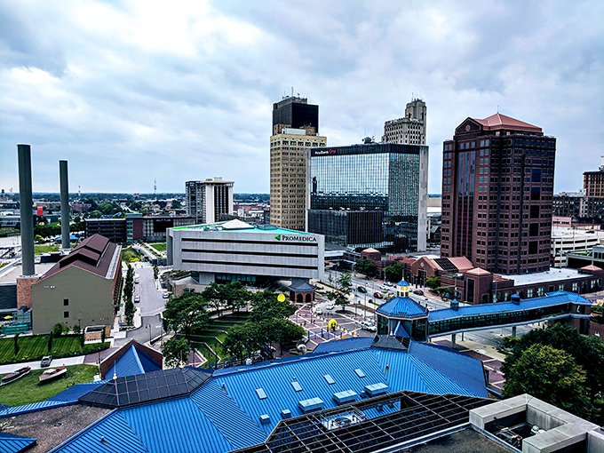 Toledo's skyline reflects in the water like a city admiring its own renaissance. Even the clouds showed up for the photo op!