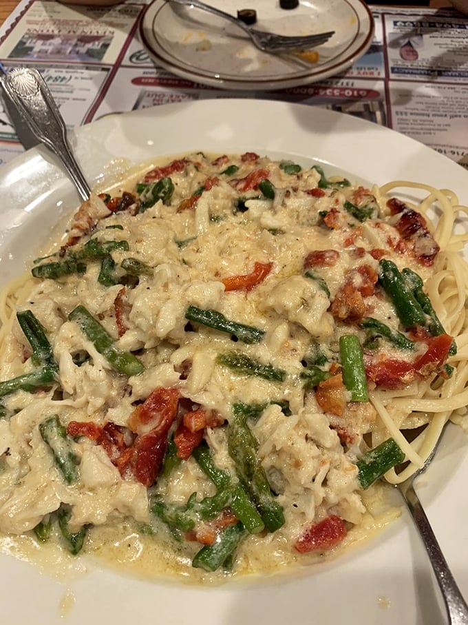 Pasta swimming in creamy sauce with fresh vegetables&mdash;proof that diners can do Italian-American classics just as well as the fancy places.