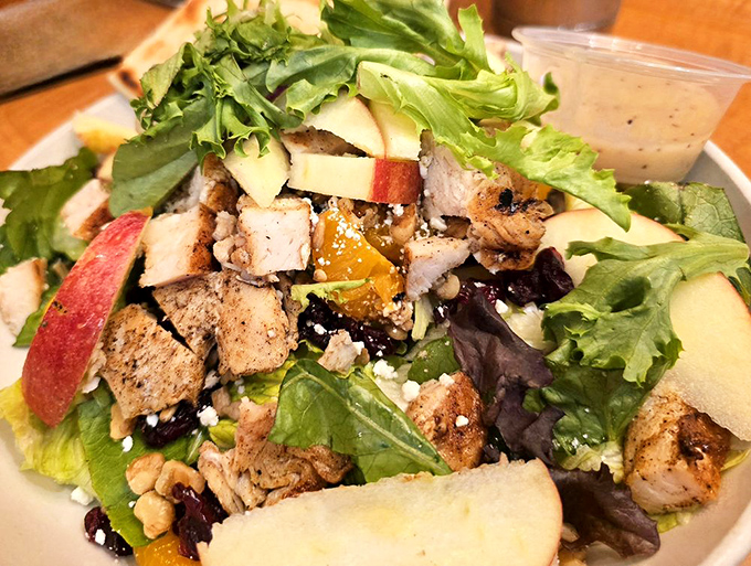 A salad that doesn't feel like punishment. Fresh greens, grilled chicken, apples, and nuts create the rare healthy option you'll actually crave again.