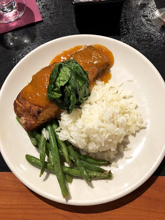 This apricot-glazed salmon with fresh spinach proves that sometimes the simplest combinations create the most memorable meals.