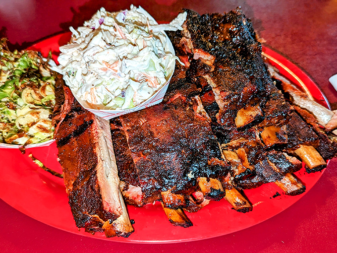 Ribs with a smoke ring so perfect it could be framed, paired with slaw that provides the perfect cool counterpoint to that peppery bark.