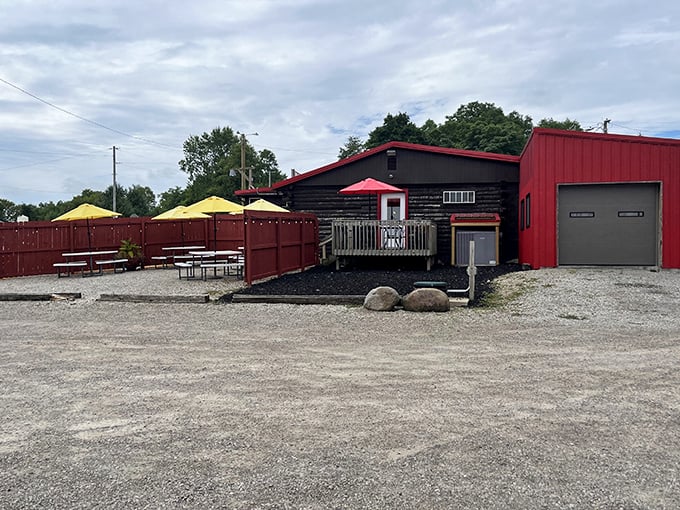 The outdoor seating area where BBQ dreams come true under yellow umbrellas. Even the building wears the classic red and black BBQ uniform.