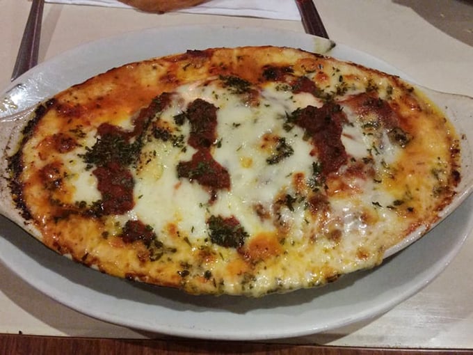 Cheese bubbling like a volcanic eruption over tender ravioli&mdash;proof that sometimes the simplest dishes deliver the most pleasure.